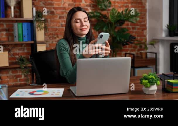 Business employee working at office. Young business woman sitting at ...