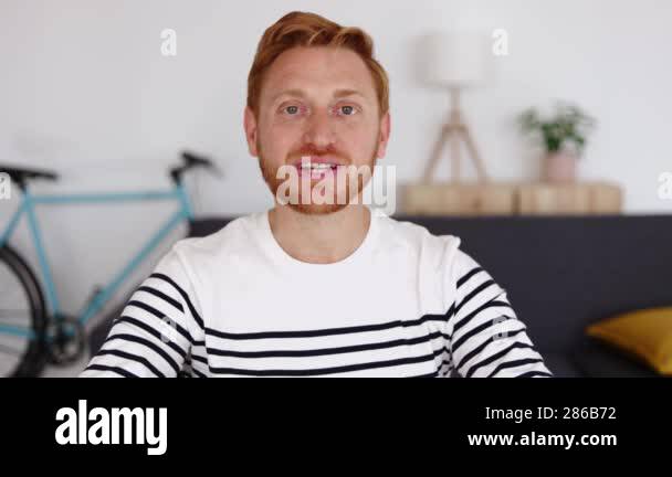 Video screen view of happy young man having an online conversation ...