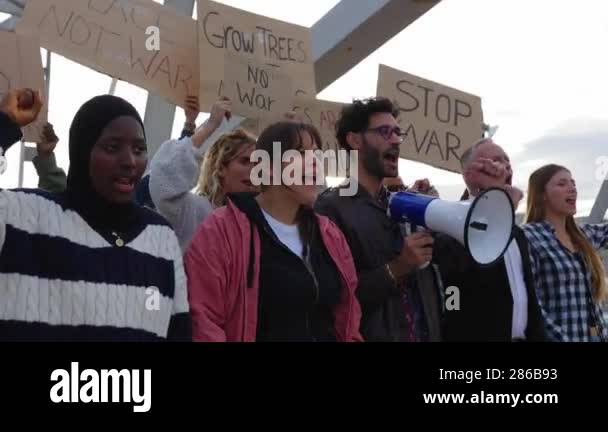 Group of diverse activist people marching for world peace. Diverse ...