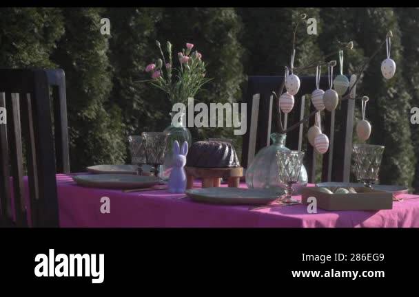 A table in the yard during spring for an Easter celebration lunch ...