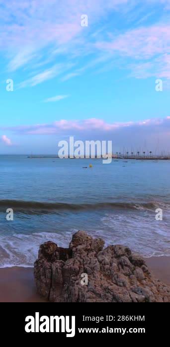 Seascape sunset in Cascais Bay a coastal resort near Lisbon known for ...