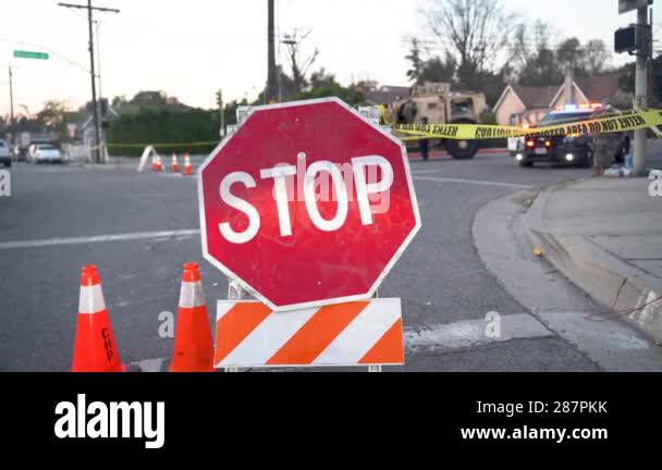 A "Stop" sign and traffic cones mark a road closure in Pasadena ...