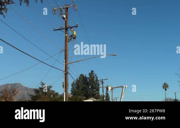 Worker climbing utility pole Stock Videos & Footage - HD and 4K Video ...