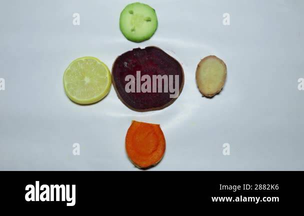 slice of fresh raw turmeric, beetroot, lemon, cucumber and ginger in ...