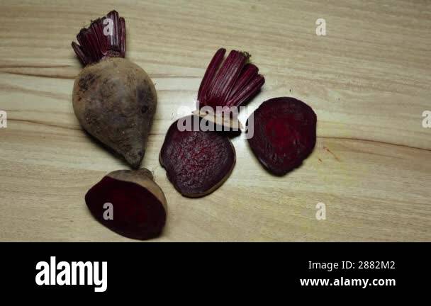 Chopping Fresh Raw beetroot Close-Up on wood board Background studio shot Stock Video Footage ...