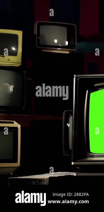 Stacked Vintage Television with Green Screen in Close Up - Vertical 4K ...