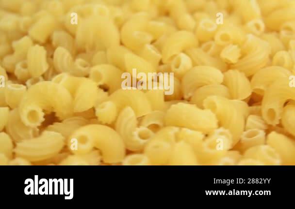 Pasta spiral twists and falls. Raw pasta. Side view Stock Video Footage ...