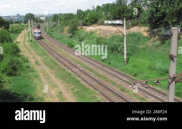 Old vintage train approaches with six railway carriages - front view ...
