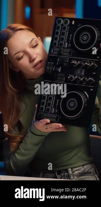 Vertical video Gen Z artist mixing on DJ turntables, doing music ...