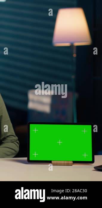 Vertical video Smiling teenager presenting followers green screen ...