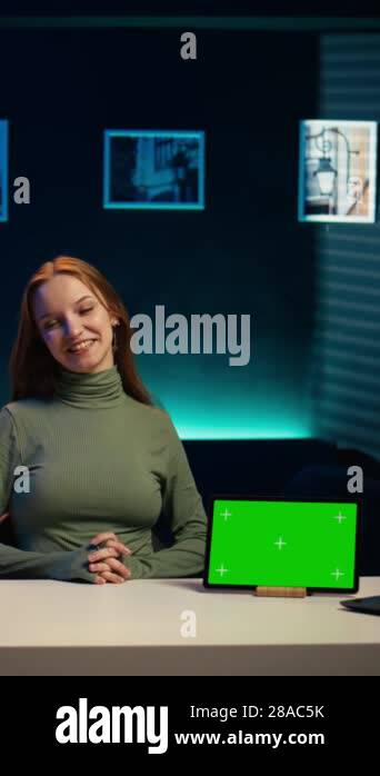 Vertical video Smiling teenager presenting followers green screen ...