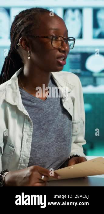 Vertical video African american medic and patient having a deep ...