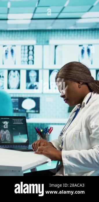 Vertical video African american woman doctor explaining radiology ...