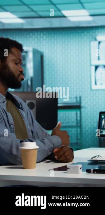 Vertical video African american medic and patient engaging in detailed ...