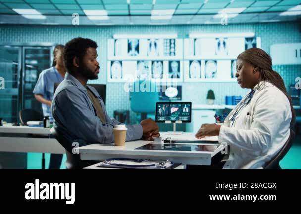 Medical interaction between a doctor and male patient with spinal pain ...