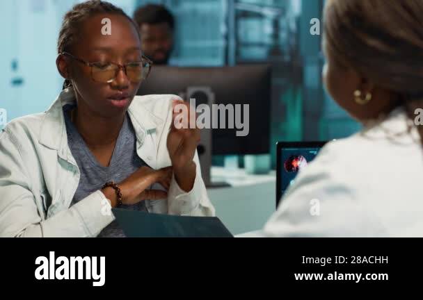 Radiologist delivering bad news about a tumor during a medical ...