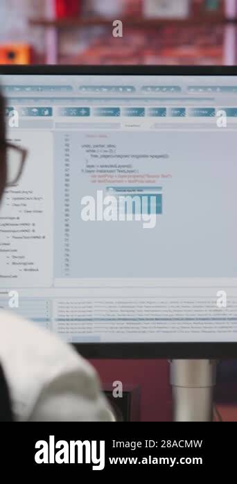 Vertical video Woman in home office looking at UI on PC screen, typing ... Vertical video Woman in home office looking at UI on PC screen, typing ...
