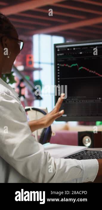 Vertical video Smiling investor having success with cryptocurrency ...