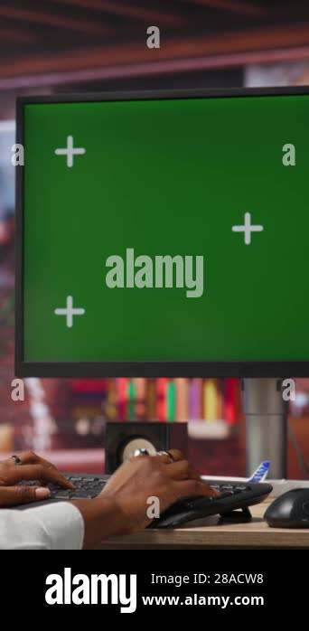 Vertical video Remote employee in home office using green screen PC and ...