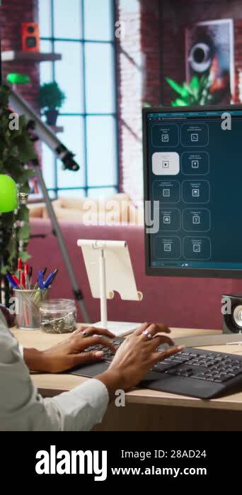 Vertical video Woman using AI program turning text prompt into videos, pleased by results ...