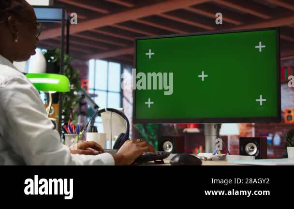 Remote employee using isolated screen PC in home office to write emails ...