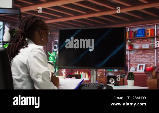 Student doing academic research on internet to gain financial knowledge useful for career ...