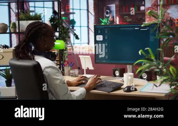 Woman using AI program turning text prompt into videos, pleased by results. Person surrounded by ...