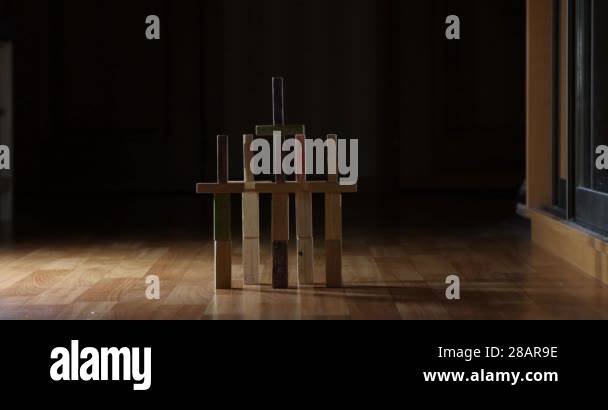 shooting to the wooden blocks in the room with their demolition Stock ...