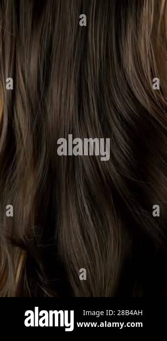 Super slow motion of wavy brown hair in detail. Filmed on high speed ...