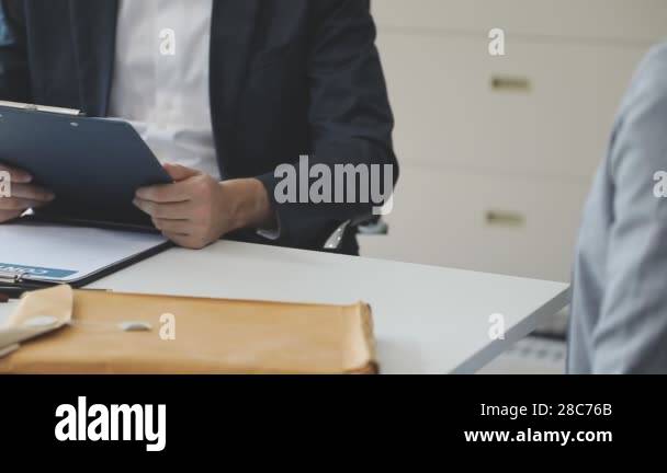 close up of businessman 's hands holding pen and using digital tablet ...