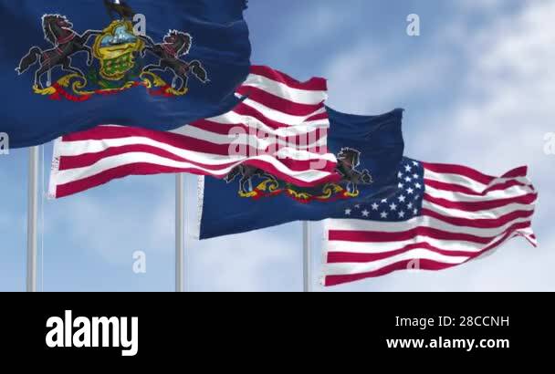 Pennsylvania state flags waving with the american flags. Blue field ...