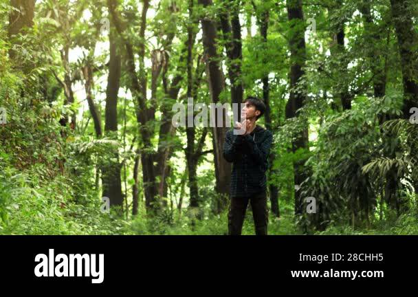Man walking alone in deep forest and feel anxiety. Man feel nervously ...