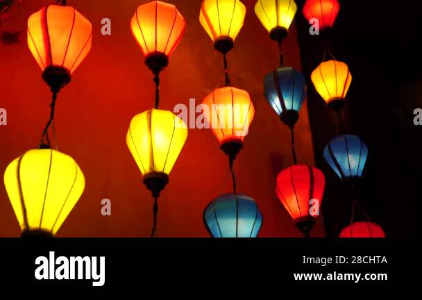 Traditional colorful lamps on the street in Hoi An old town at night ...