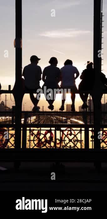 Young people city dwellers enjoying the sunset after work free time ...