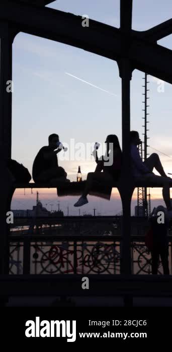 Young people city dwellers enjoying the sunset after work free time ...