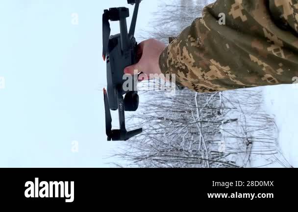 Soldier operates fighting drone in field for surveillance during ...