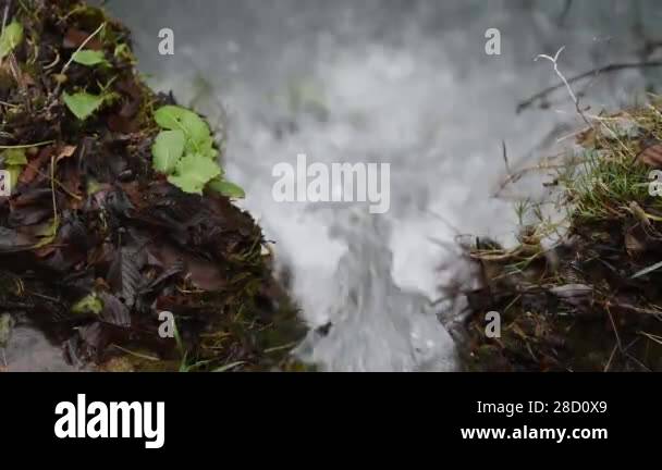 Top down view of small waterfall, water fall from edge in abyss in ...