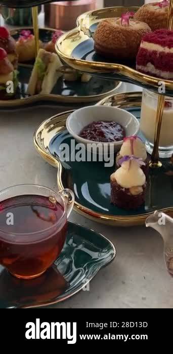 Elegant afternoon tea setup, complete with tiered trays of fresh ...