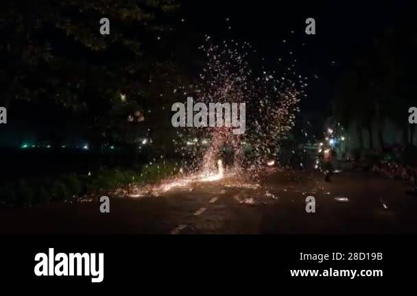 Slow motion fire busker captivates a bustling crowd with a mesmerizing ...