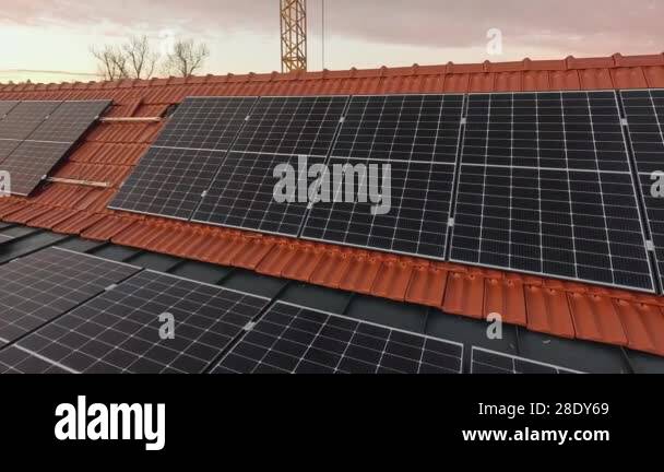 Solar Panels on a High-Rise Rooftop at Sunset Capturing Golden Light ...