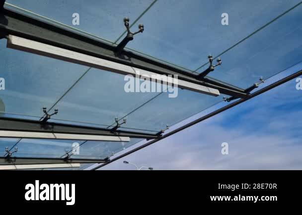 suspended glass roof above building entrance. bus station railway ...