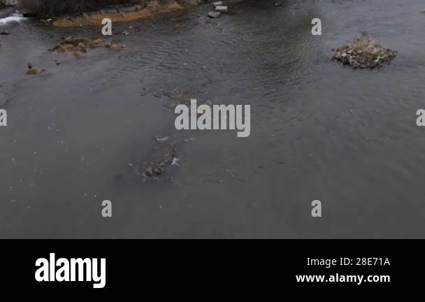 newly created natural embankment by river. benches, terraces, relaxed ...