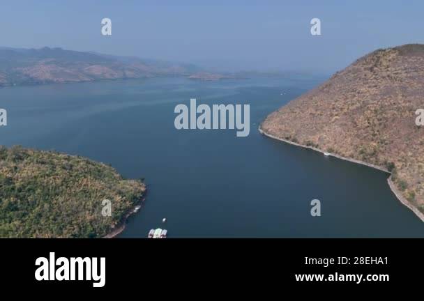 4K Aerial view of beautiful landscape of mountains and blue lake with ...