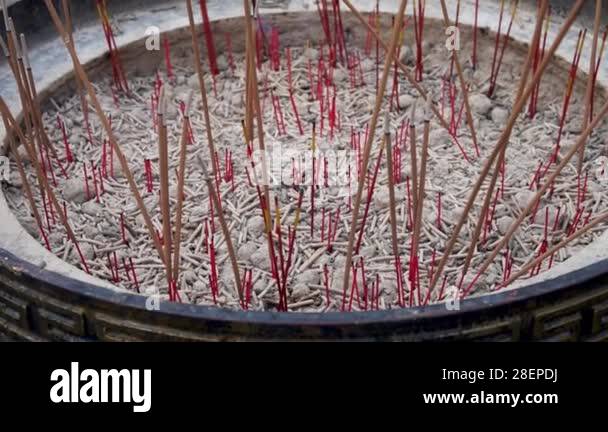 Tilt Up Slow Motion of Traditional Incense Burner with Smoking Sticks ...