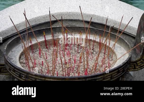 Slow Motion of Traditional Incense Burner with Smoking Sticks in a ...