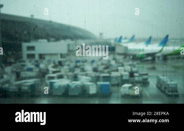 Slow Motion Airport on a Rainy Day with Aircraft and Ground Support ...