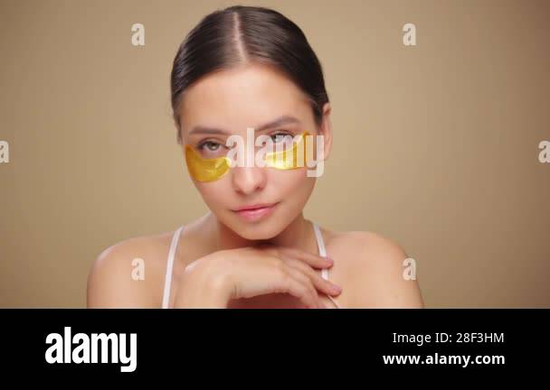 Face, eye patches and woman with skin care, beauty and treatment ...