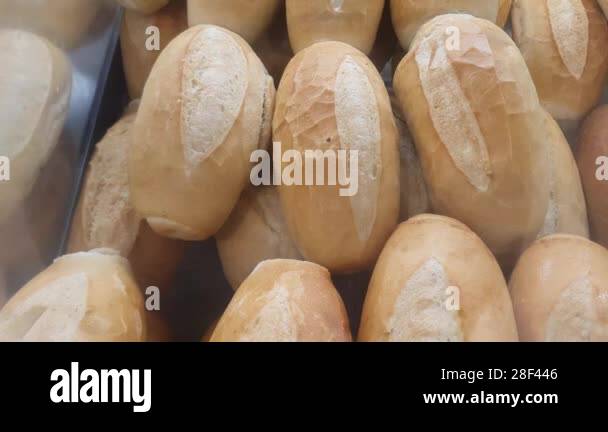 Brazilian rolls displayed in a glass display at a Brazilian bakery ...