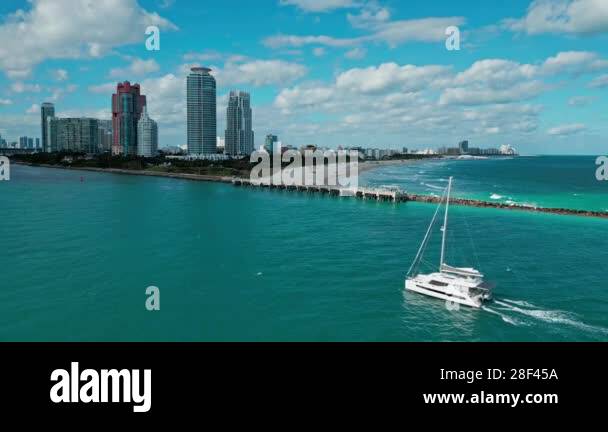 Luxury catamaran at marina. South beach aerial. Catamaran at sea of ...
