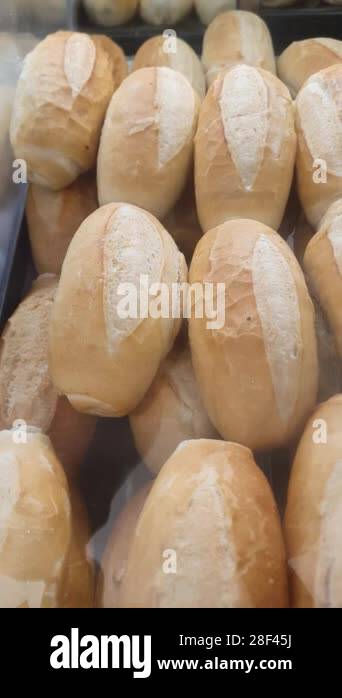 Brazilian rolls displayed in a glass display at a Brazilian bakery ...